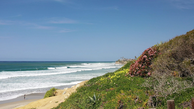 Busy surf revealed from the shores of Pacific Beach during a clear day ...